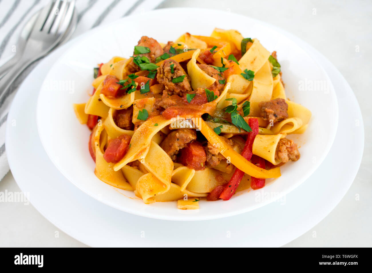 Pappardelle Pasta with Italian Sausage and Basil Stock Photo - Alamy