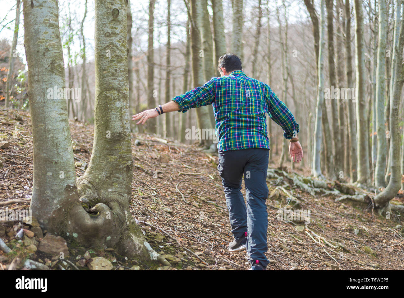 Back view young man hiking hi-res stock photography and images - Alamy