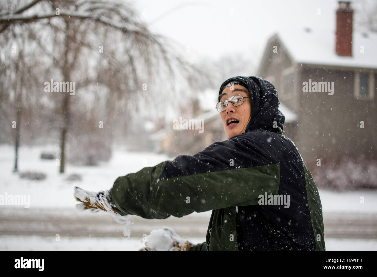 Throwing a snowball hi-res stock photography and images - Alamy