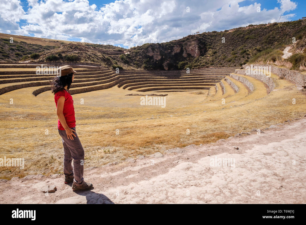 Female visitor looking at the extraordinary circular terraces at Moray ...