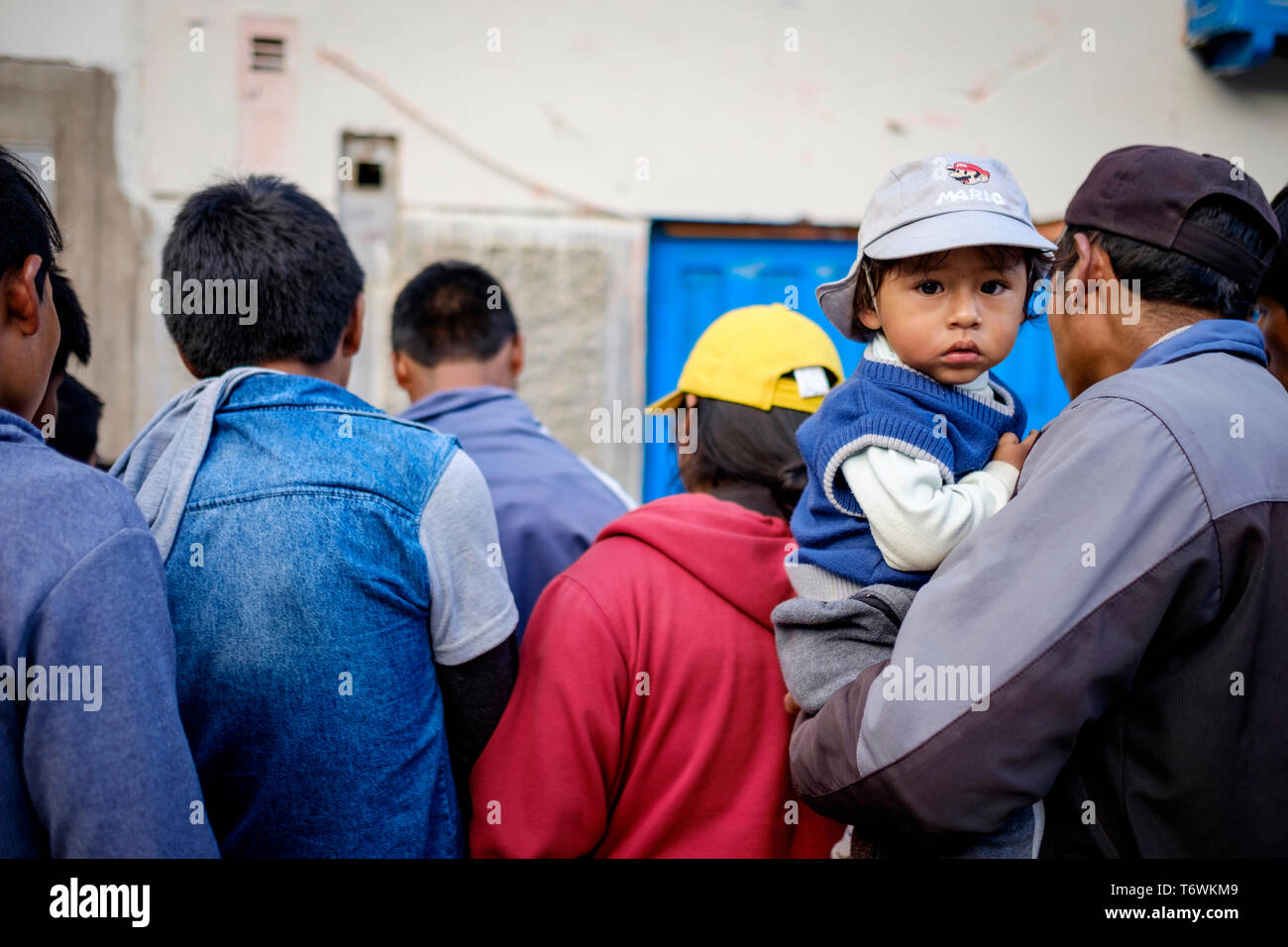 Child with his father on the streets of Paucartambo, Peru Stock Photo ...