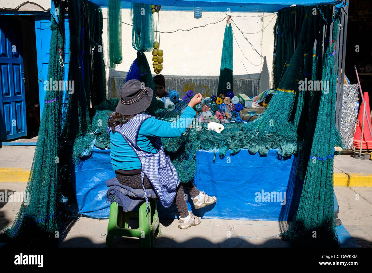 Rope and meshes seller on the streets of Paucartambo, Cusco Region ...