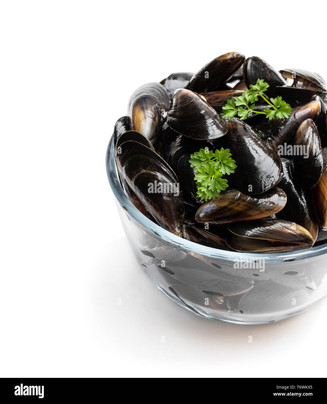 Raw mussels in glass bowl isolated on white Stock Photo - Alamy