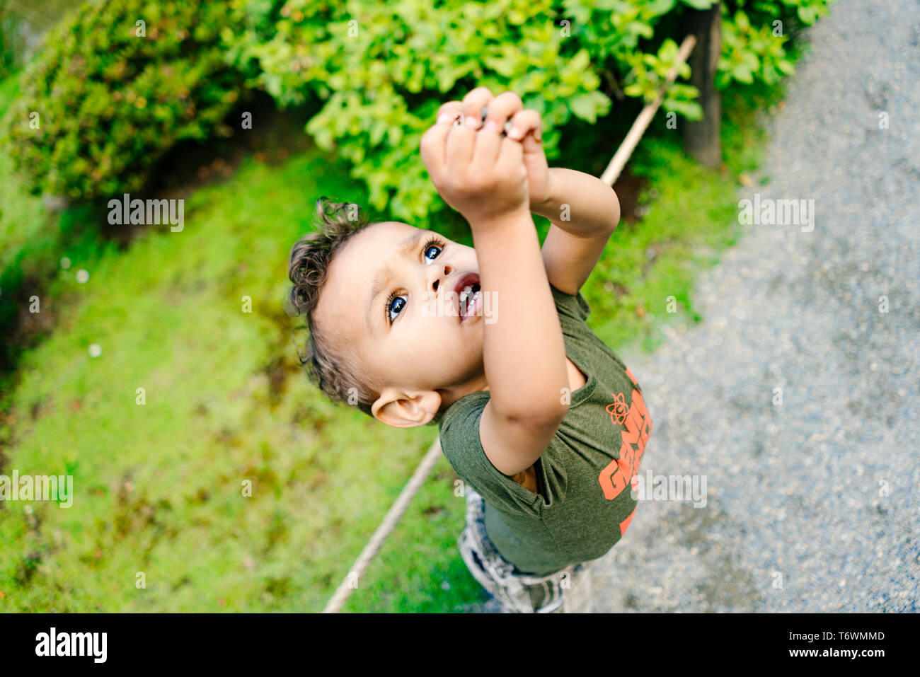 View from above of a young boy reaching upwards Stock Photo - Alamy