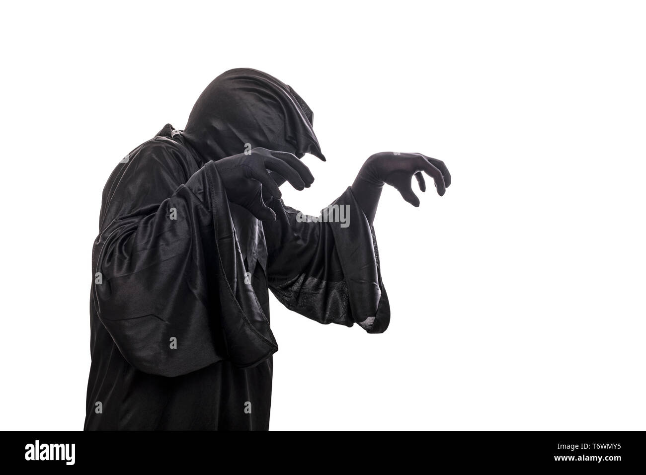 Spooky monster in hooded cloak isolated on white background Stock Photo ...