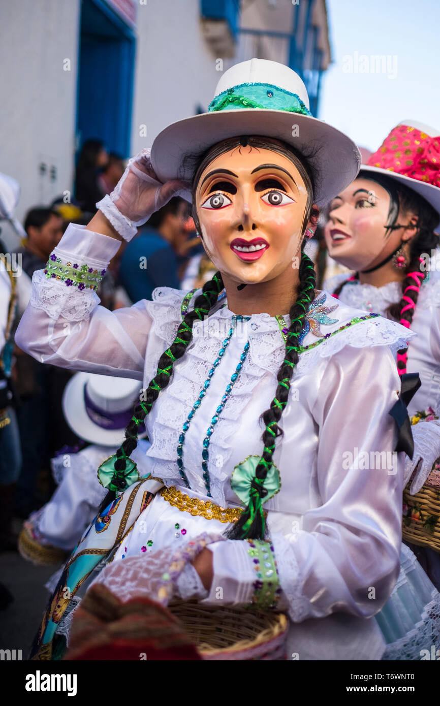 Masked and costumed characters on the parade of Festival of the Virgin ...