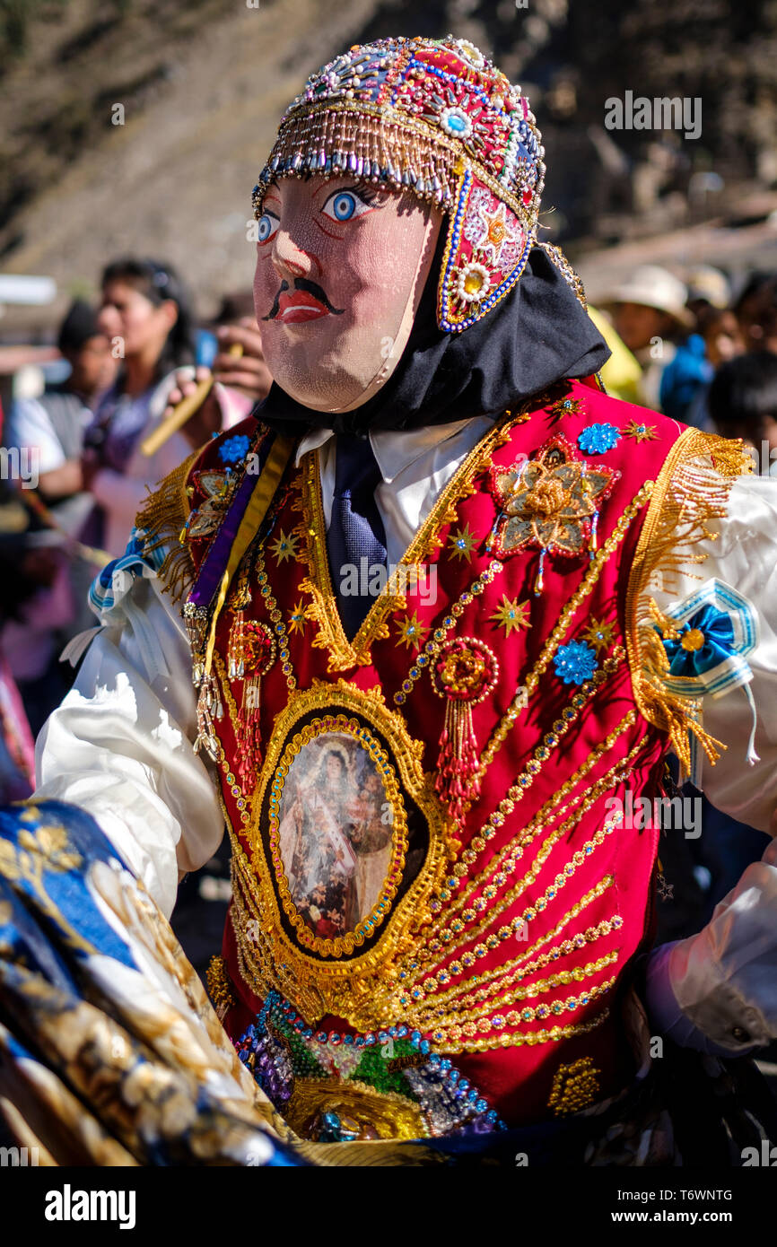 Masked and costumed characters on the parade of Festival of the Virgin ...