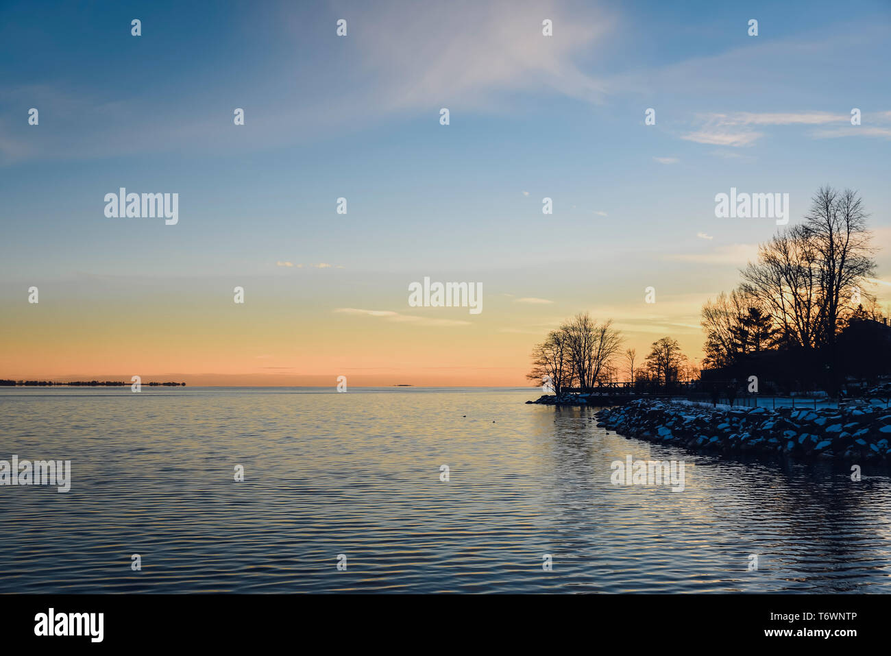Shoreline of Lake Ontario at sunset on a winter evening Stock Photo - Alamy