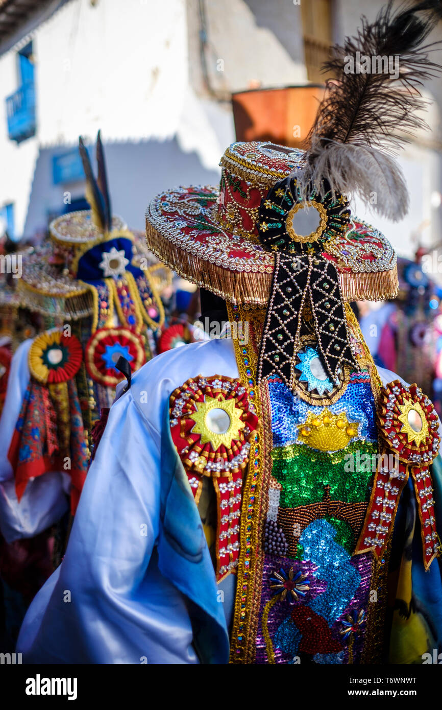 Masked and costumed characters on the parade of Festival of the Virgin ...