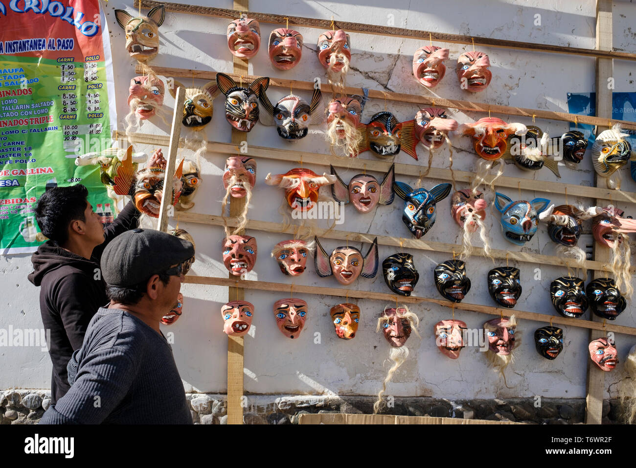 Selling masks on the streets of paucartambo during Festival of the ...