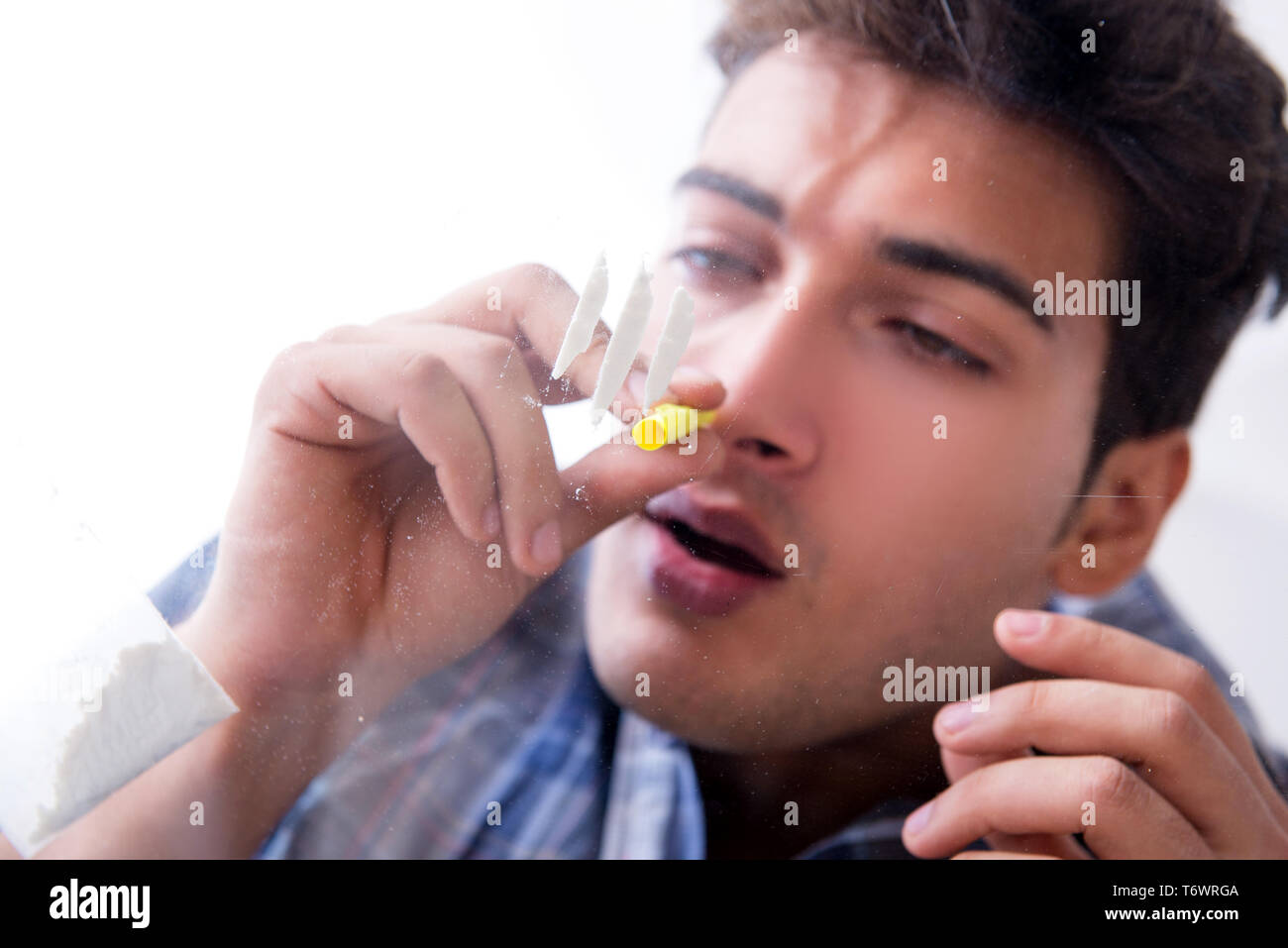 Drug addict sniffing cocaine narcotic Stock Photo - Alamy