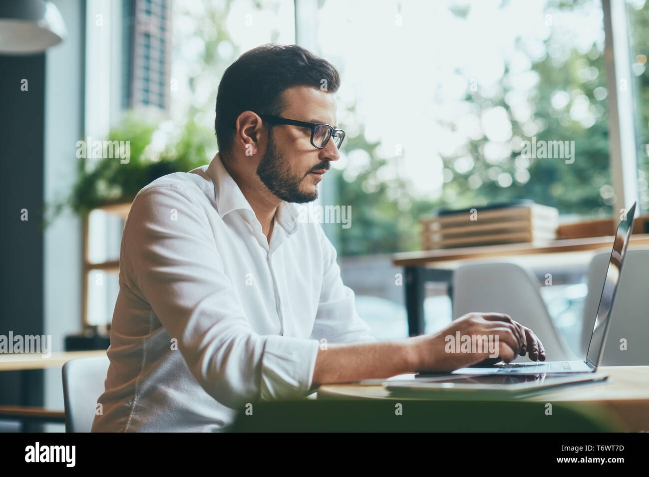 Working cafe teenage male hi-res stock photography and images - Alamy
