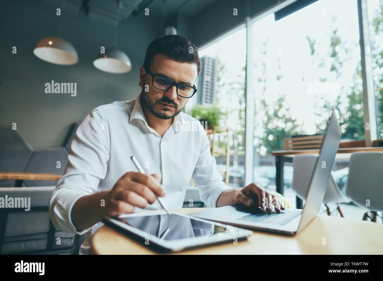 Working process in cafe Stock Photo - Alamy