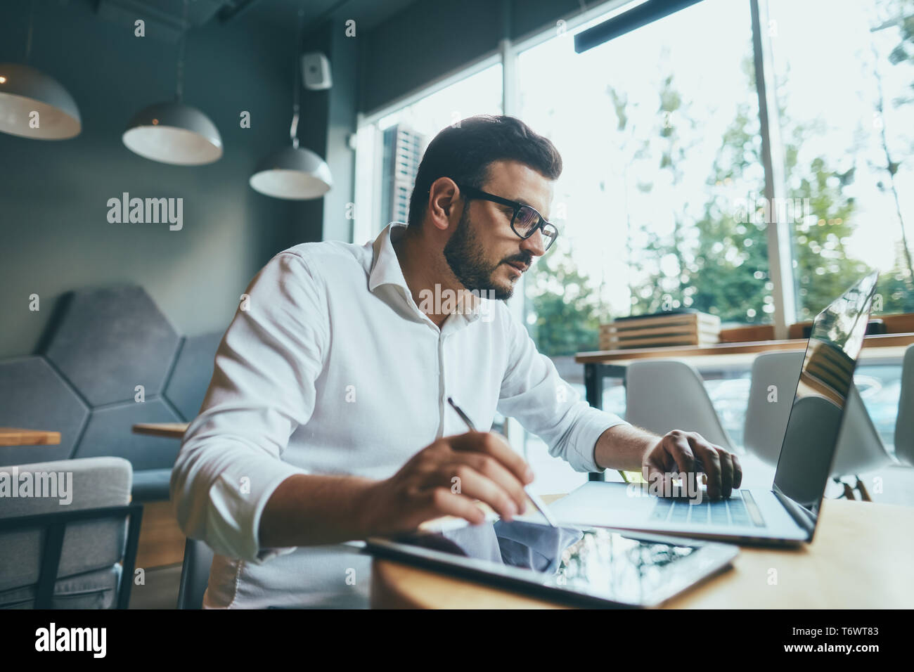 Working cafe teenage male hi-res stock photography and images - Alamy