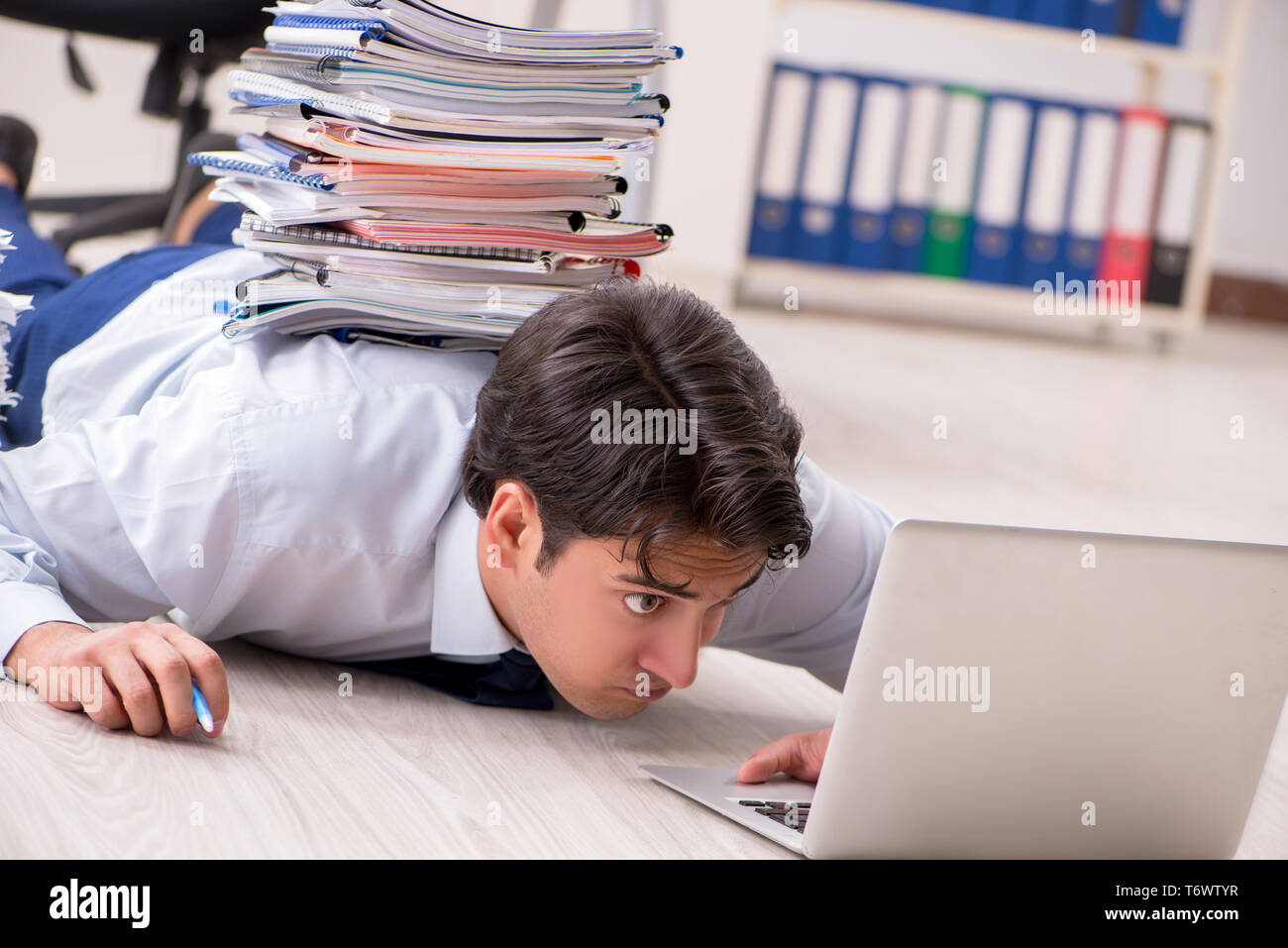 Extremely busy employee working in the office Stock Photo - Alamy