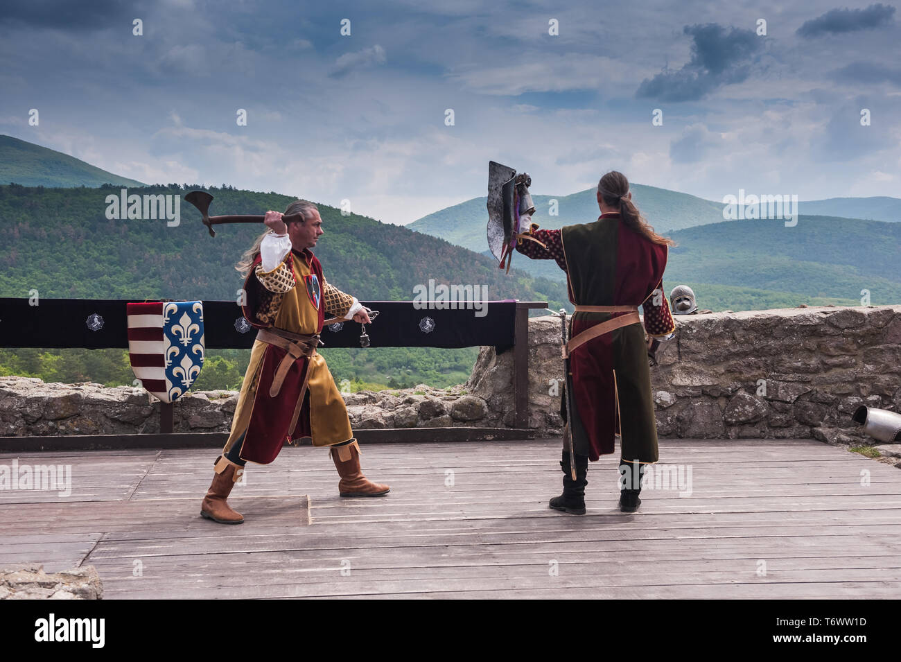 Knights demonstrating medieval weapons in Castle Boldogkovaralja ...