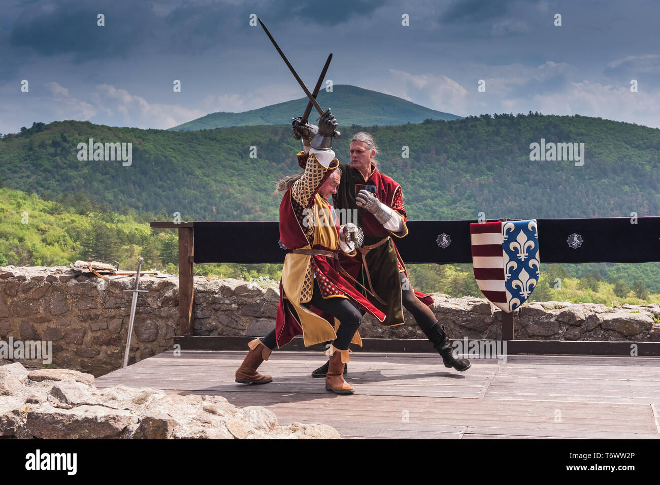 Knights fighting with long-swords in Castle Boldogkovaralja, Hungary ...