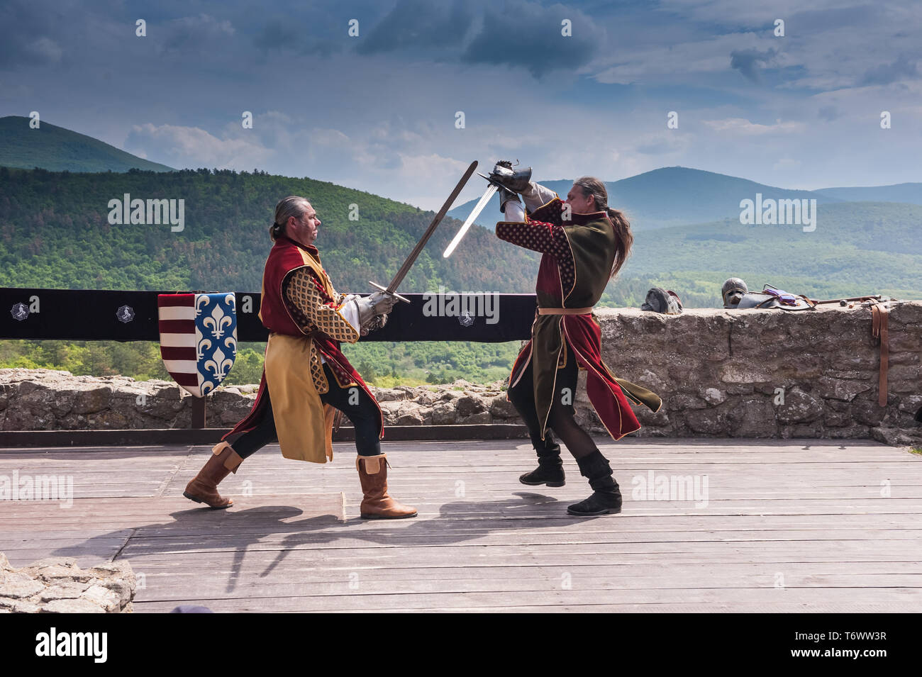 Knights fighting with long-swords in Castle Boldogkovaralja, Hungary ...