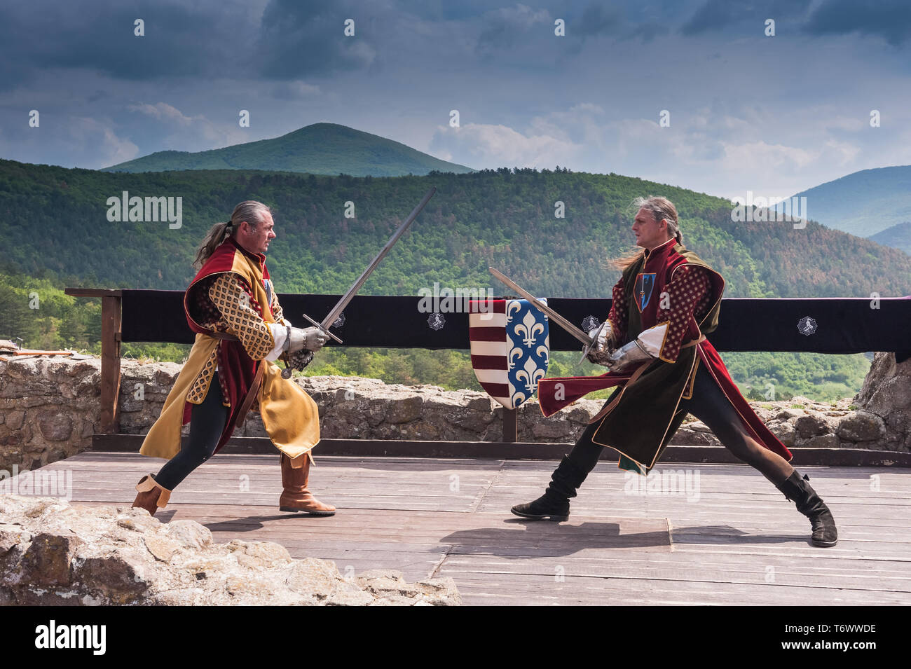 Knights fighting with long-swords in Castle Boldogkovaralja, Hungary ...