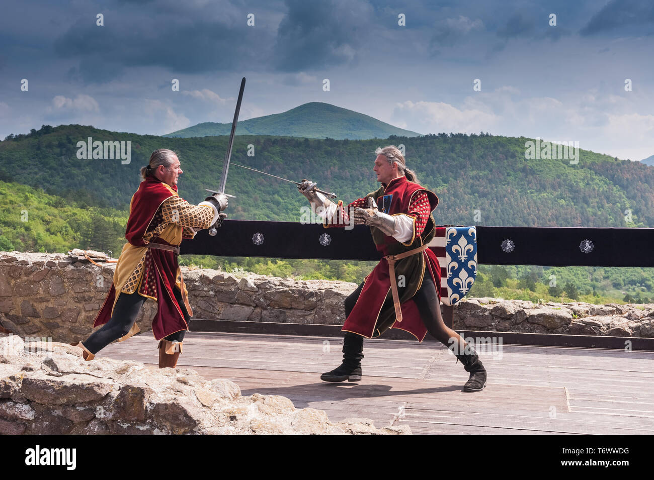 Knights fighting with long-swords in Castle Boldogkovaralja, Hungary ...