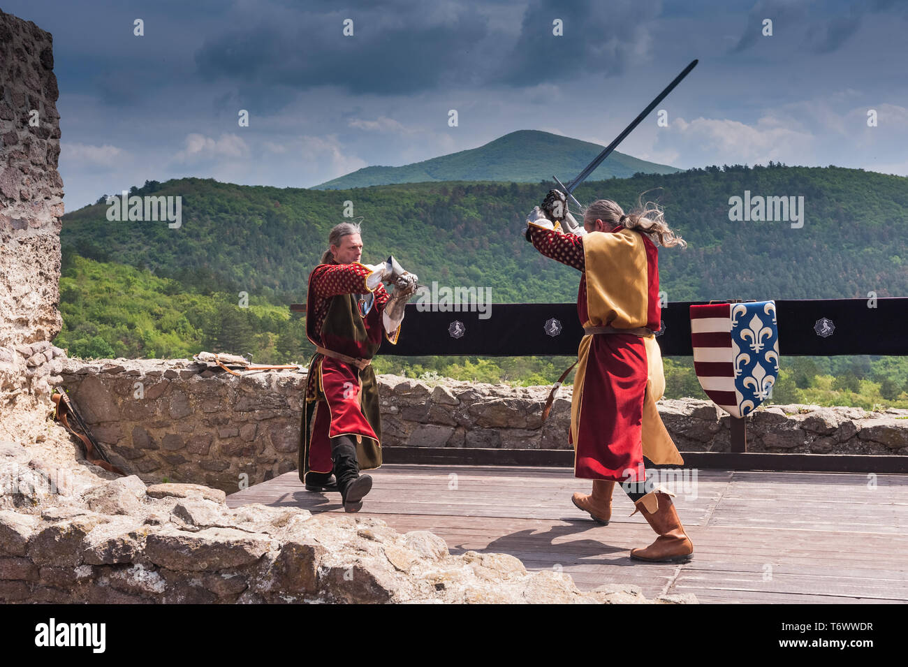 Knights fighting with long-swords in Castle Boldogkovaralja, Hungary ...