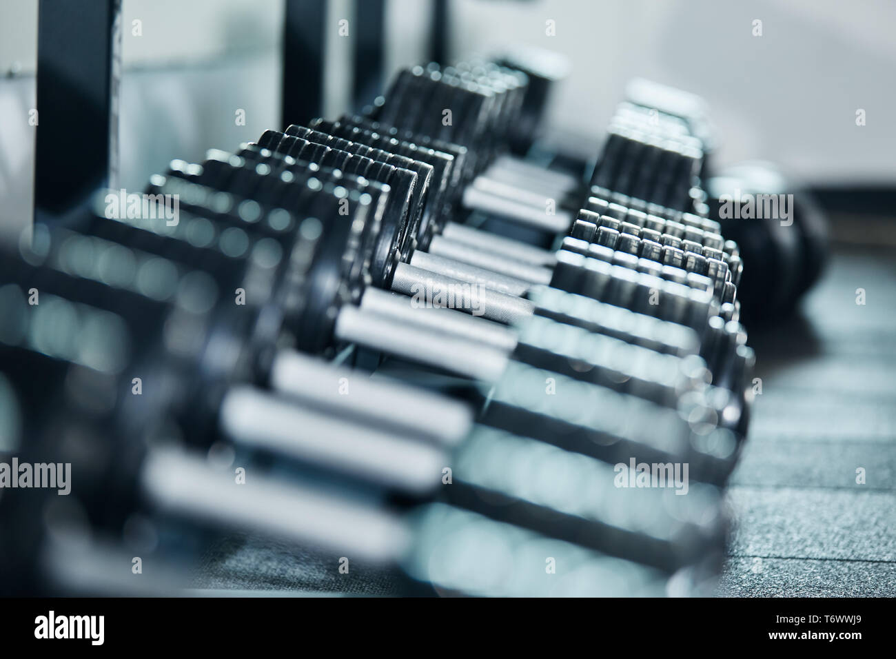 Dumbbells in gym Stock Photo - Alamy