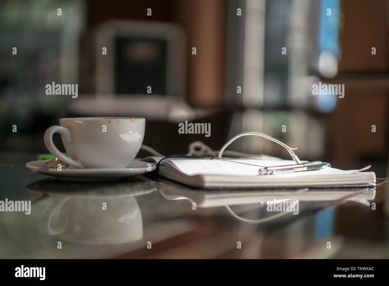 Still life of a diary and a cup of coffee in a coffee shop Stock Photo ...