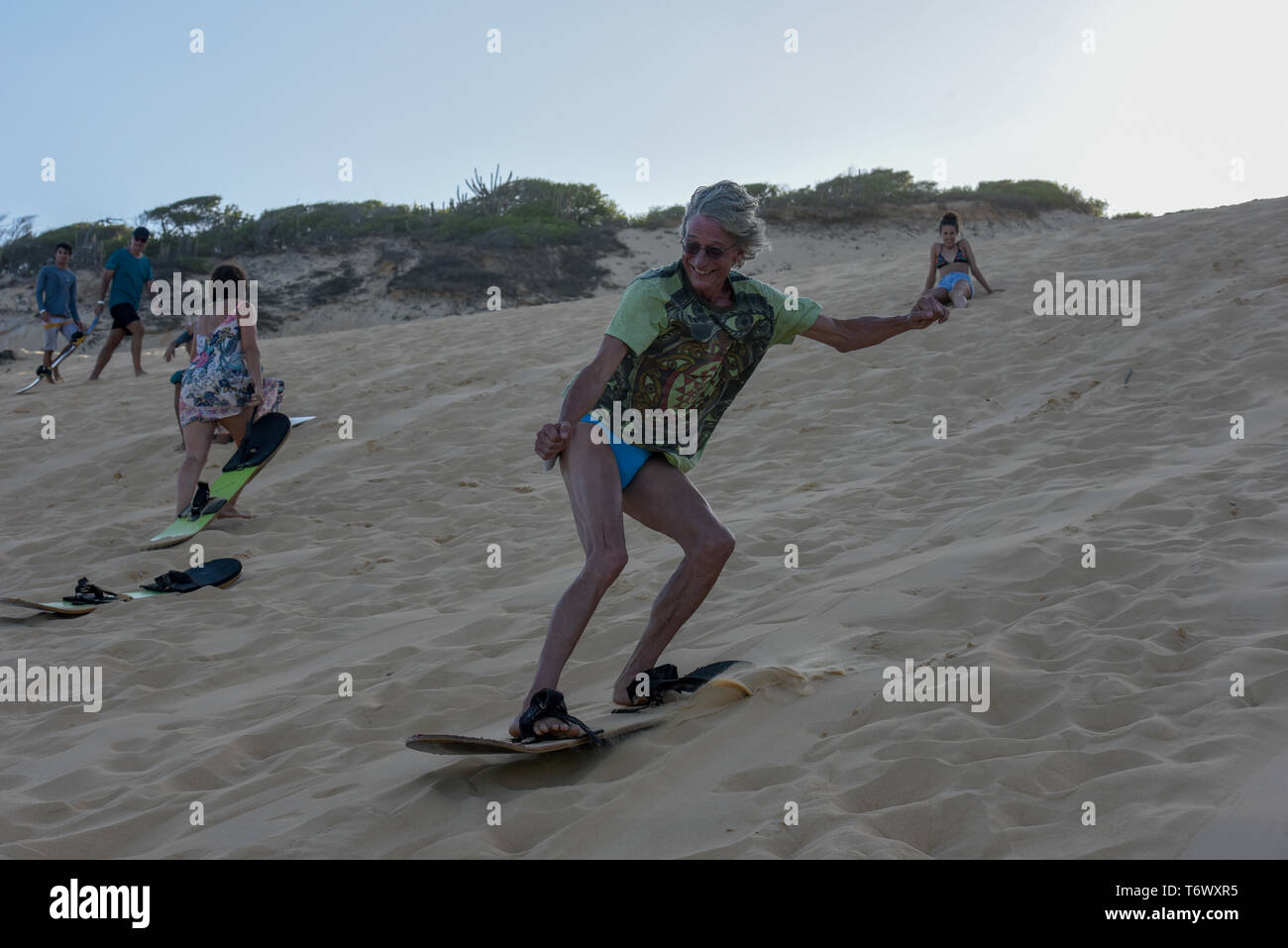 Pipa, Brazil - 23 January 2019: Tourists Sandboarding on a dune near ...
