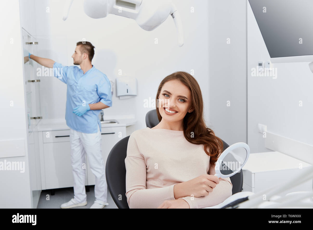Satisfied patient after dentist session Stock Photo - Alamy
