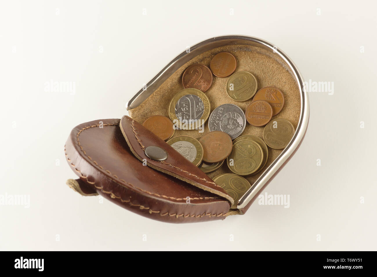 the modern brown leather wallet with small coins Stock Photo - Alamy