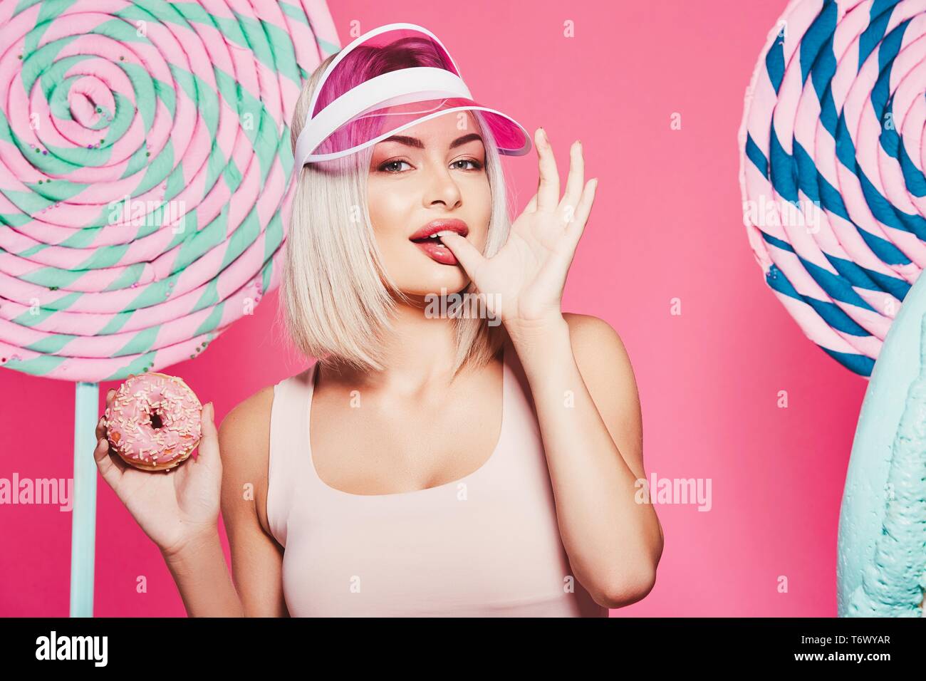 Attractive model with sweets Stock Photo - Alamy