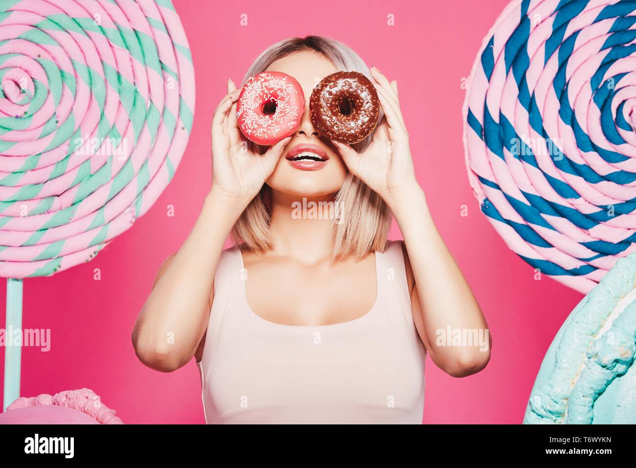 Attractive model with sweets Stock Photo - Alamy