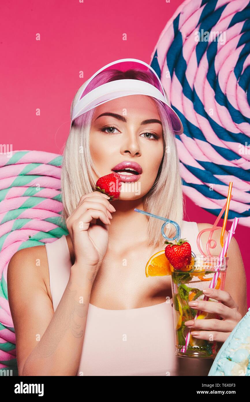 Cute model with sweets Stock Photo - Alamy