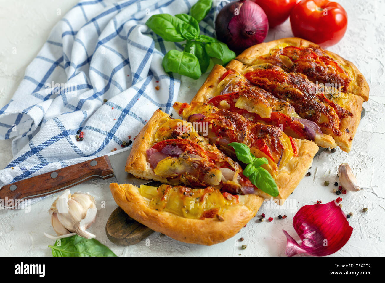 Vegetable pie with potatoes, onions and tomato Stock Photo - Alamy