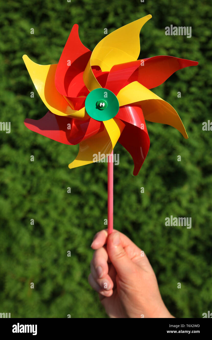 Hand holds beautiful windmill Stock Photo - Alamy