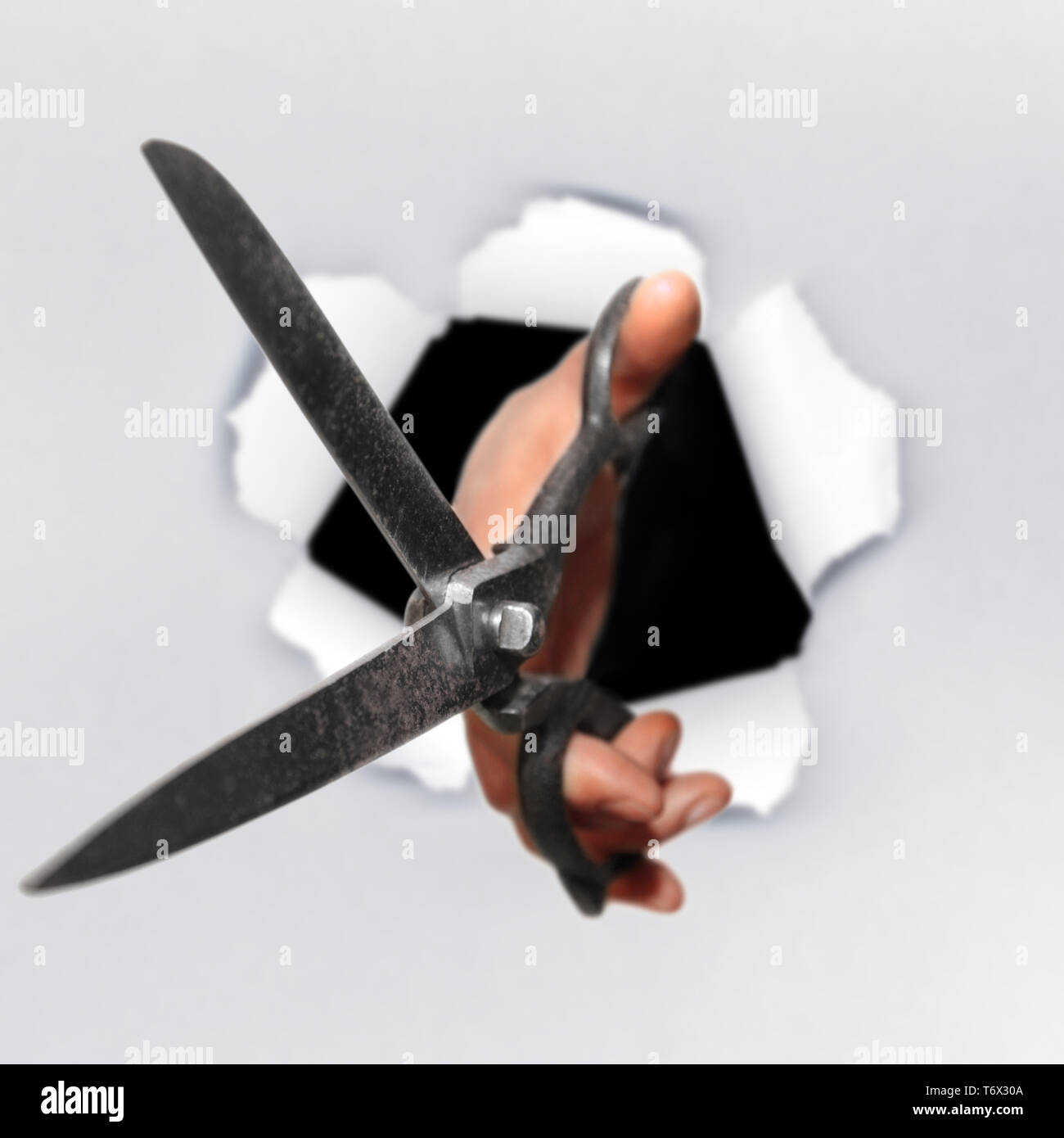 man holds scissors Stock Photo - Alamy