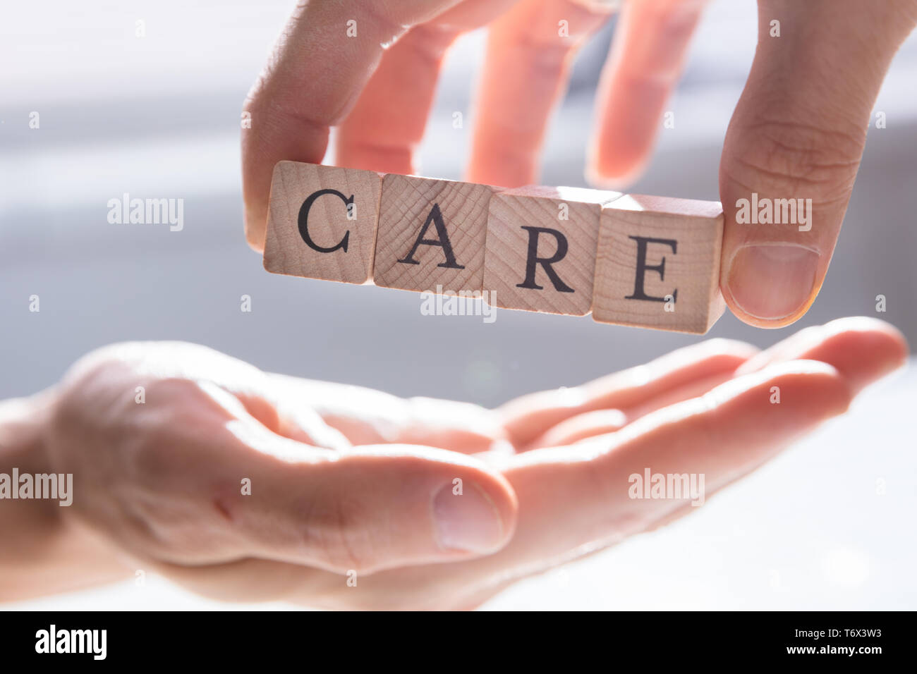 Close-up Of Person's Hand Giving Care To Other Person Stock Photo - Alamy