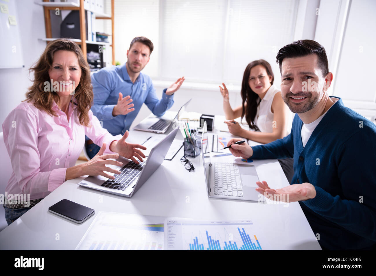 Group Of Business Executives Complaining Toward Camera In Office Stock ...