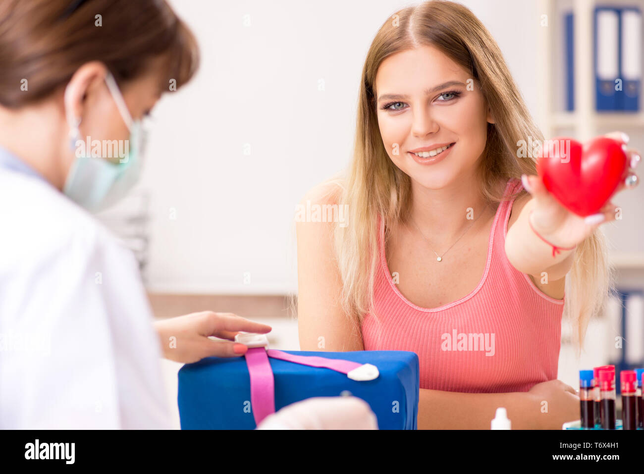 Young beautiful woman during blood test sampling procedure Stock Photo ...