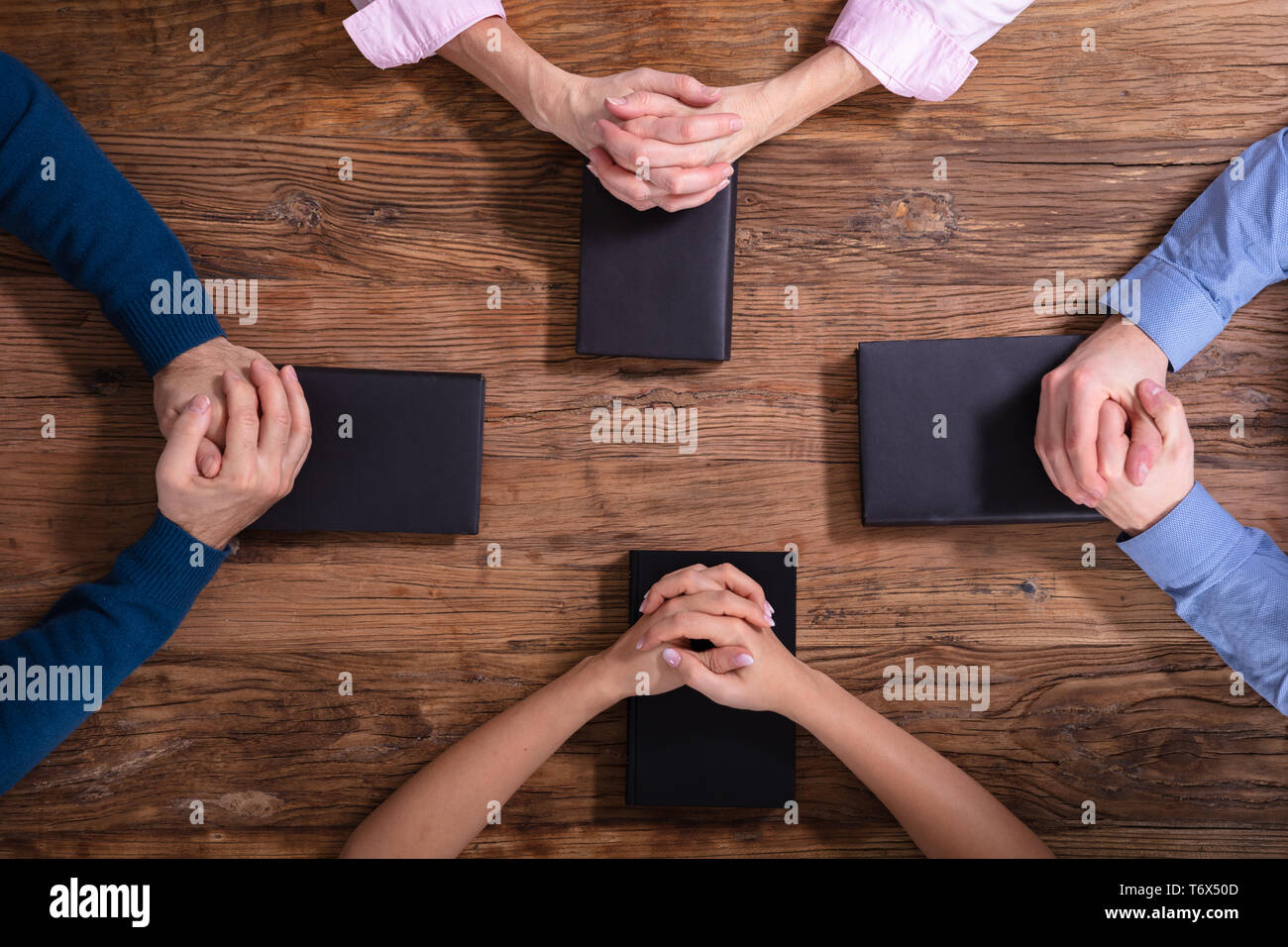 Group praying hands hi-res stock photography and images - Alamy