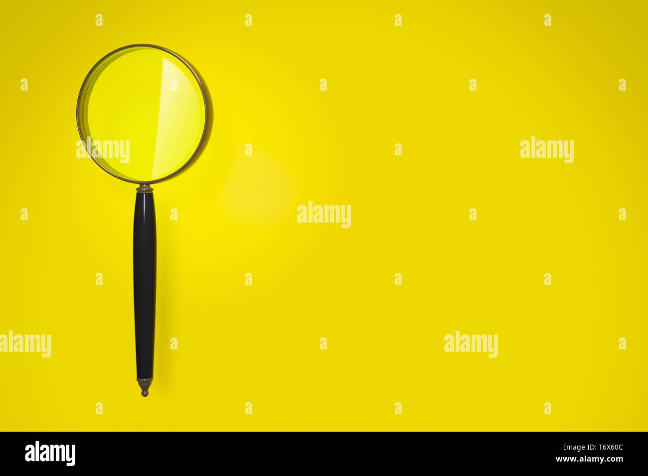 magnifying glass on yellow background Stock Photo - Alamy