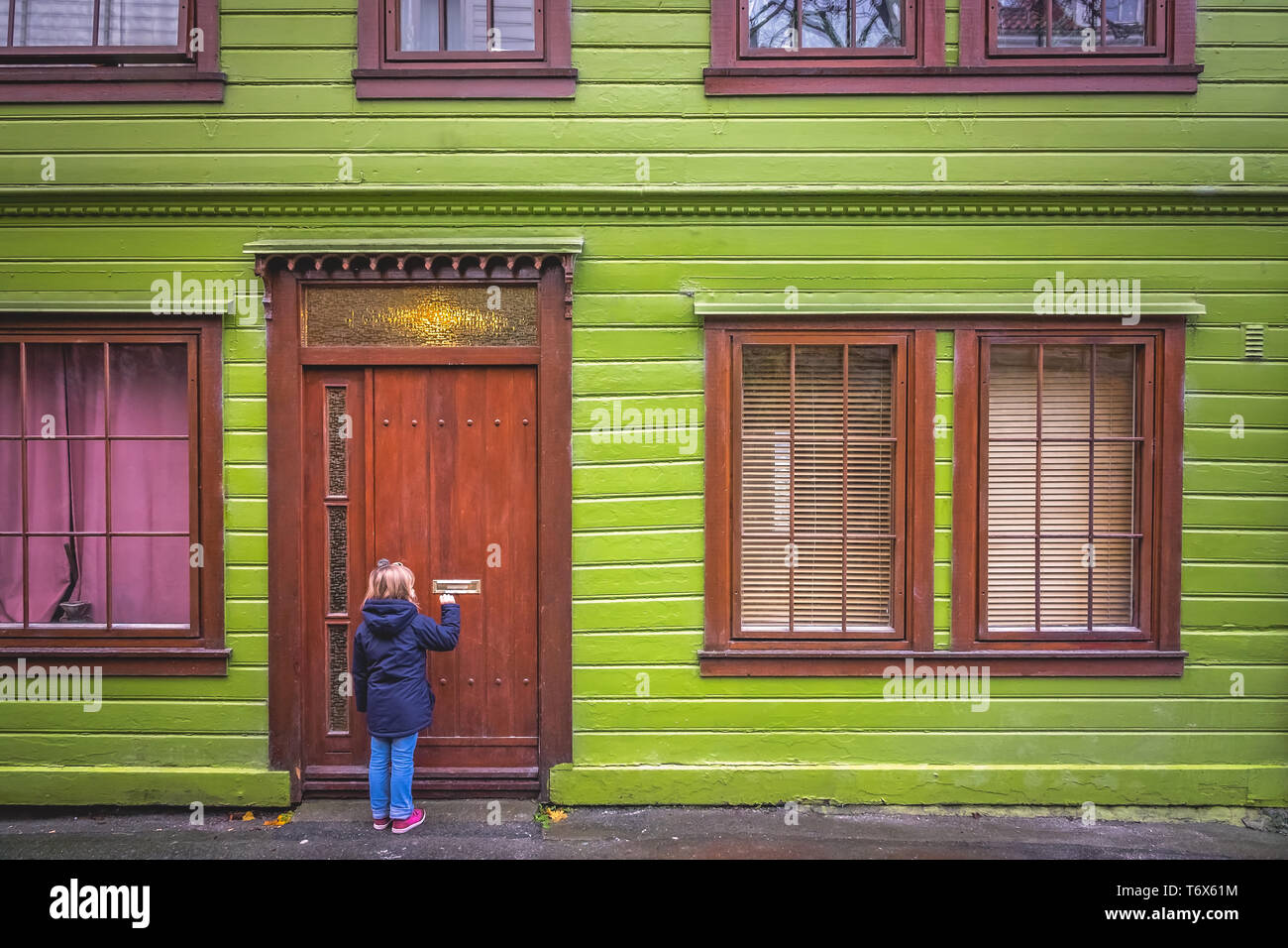 Girl knocking at door hi-res stock photography and images - Alamy