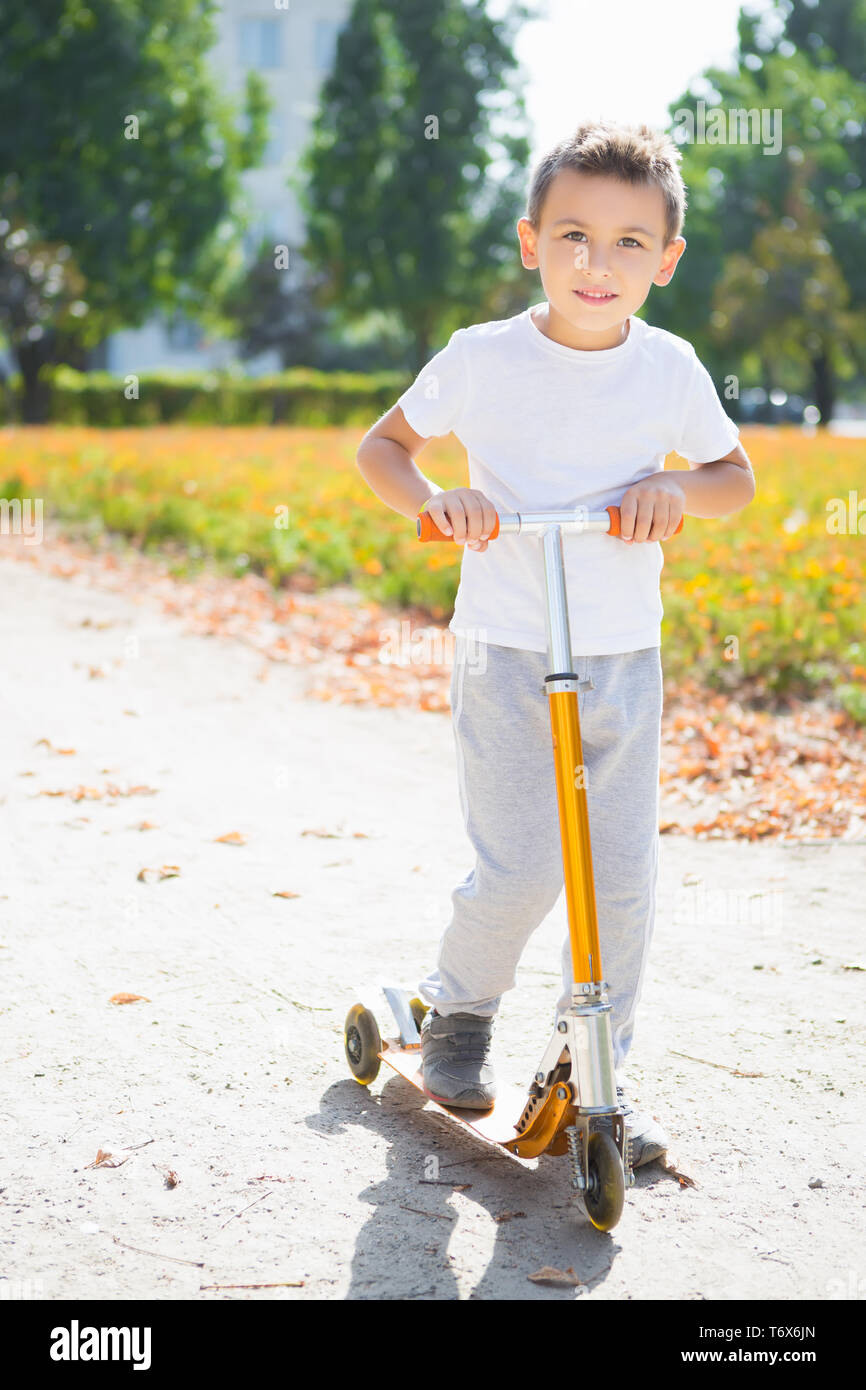 The boy rides along the path Stock Photo - Alamy