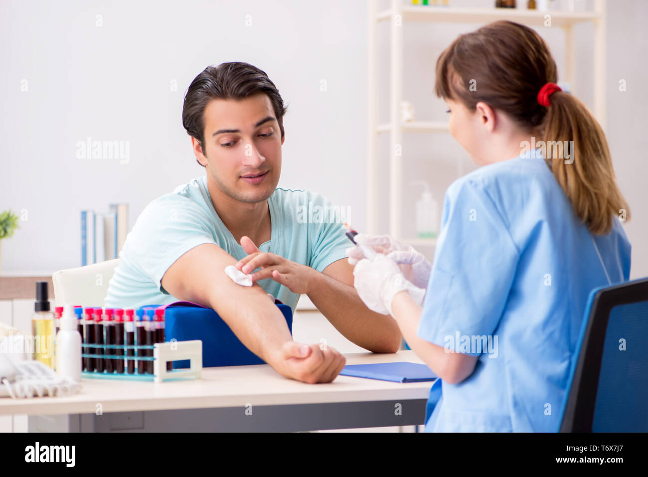 Young patient during blood test sampling procedure Stock Photo - Alamy
