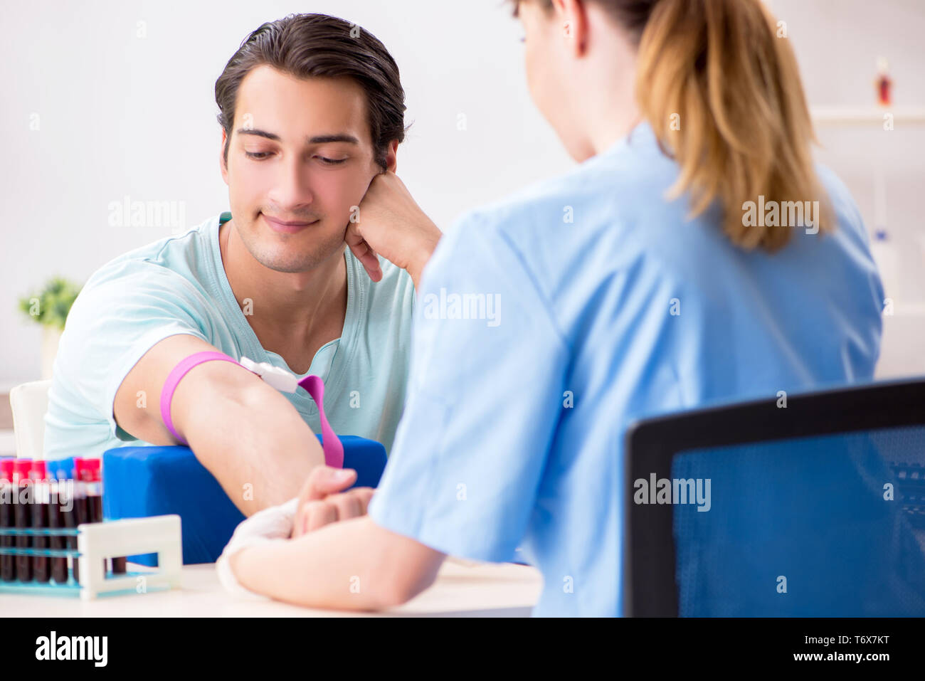 Young patient during blood test sampling procedure Stock Photo - Alamy