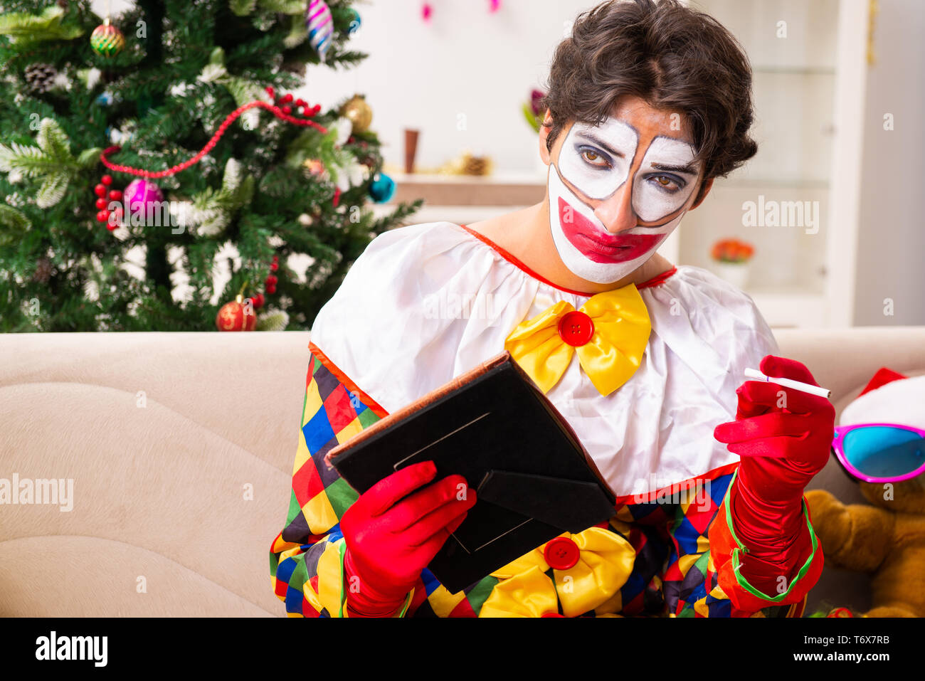 Funny clown in Christmas celebration concept Stock Photo - Alamy