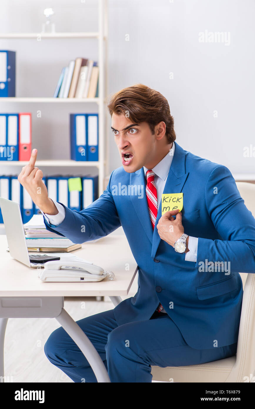 Office prank with kick me message on sticky note Stock Photo - Alamy