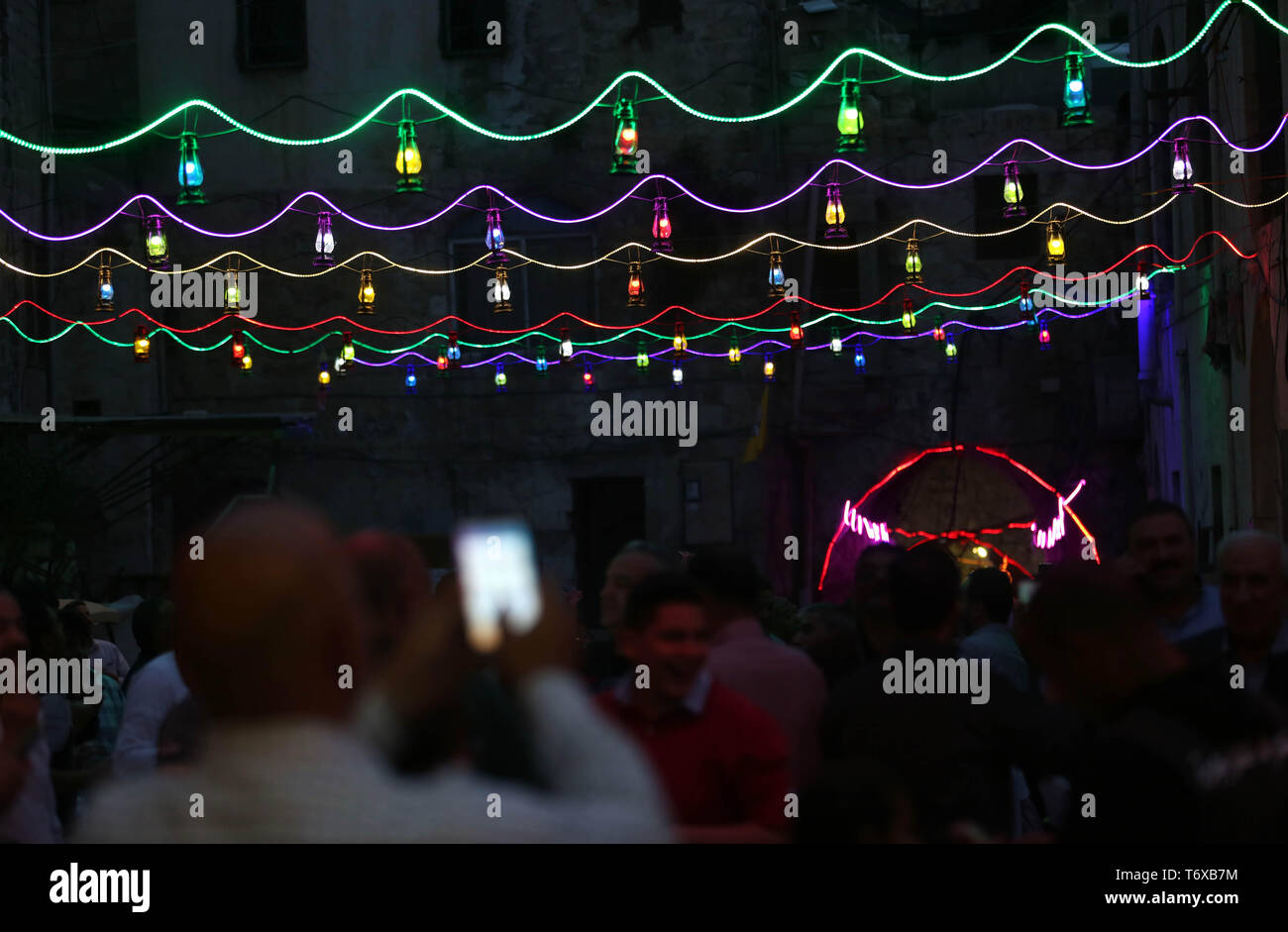 Nablus. 2nd May, 2019. Lights and lanterns are lit up to decorate a street to welcome the ...