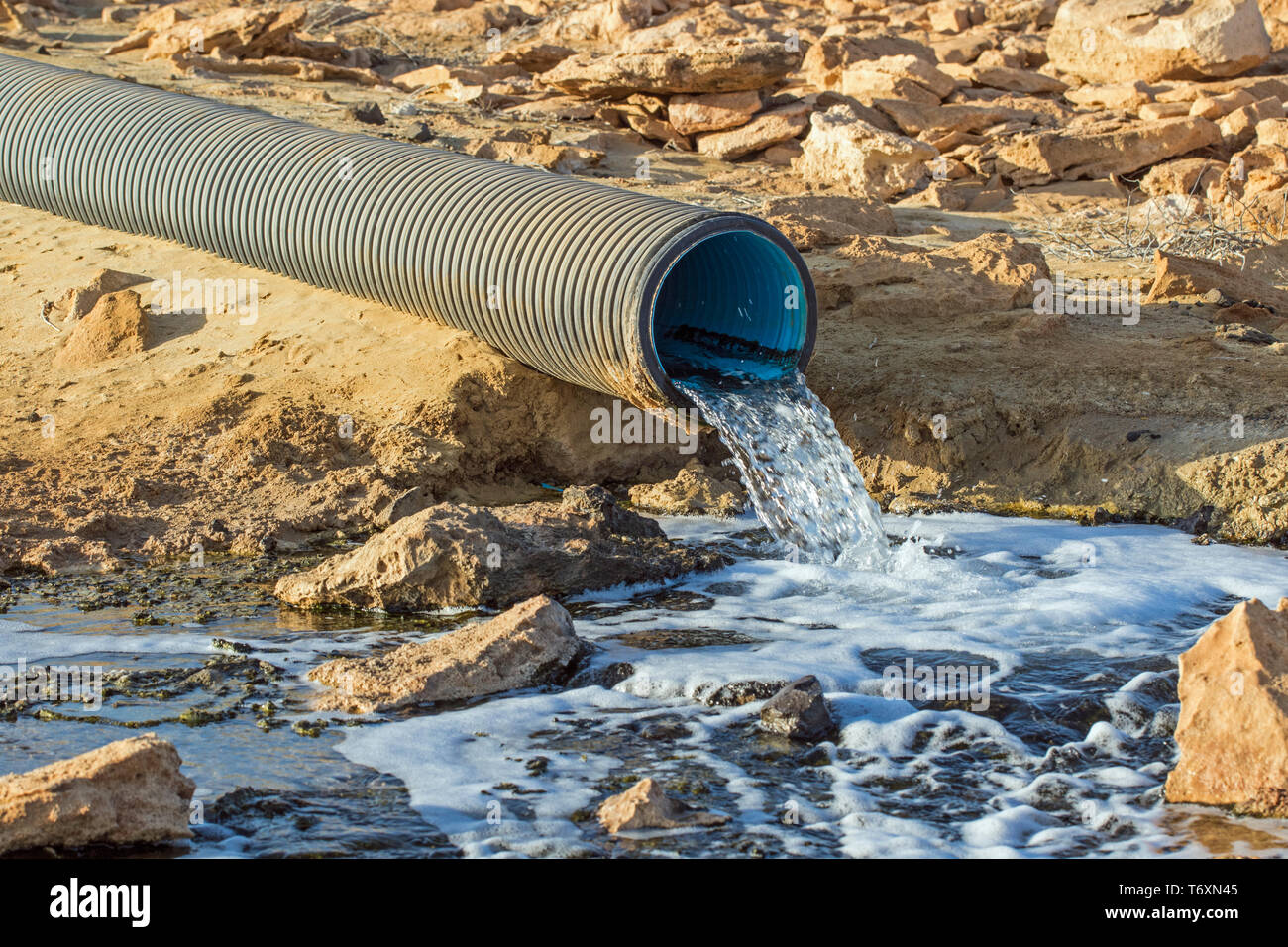 Water flowing out of pipe in desert, Santa Monica, Boa Vista, Cape ...