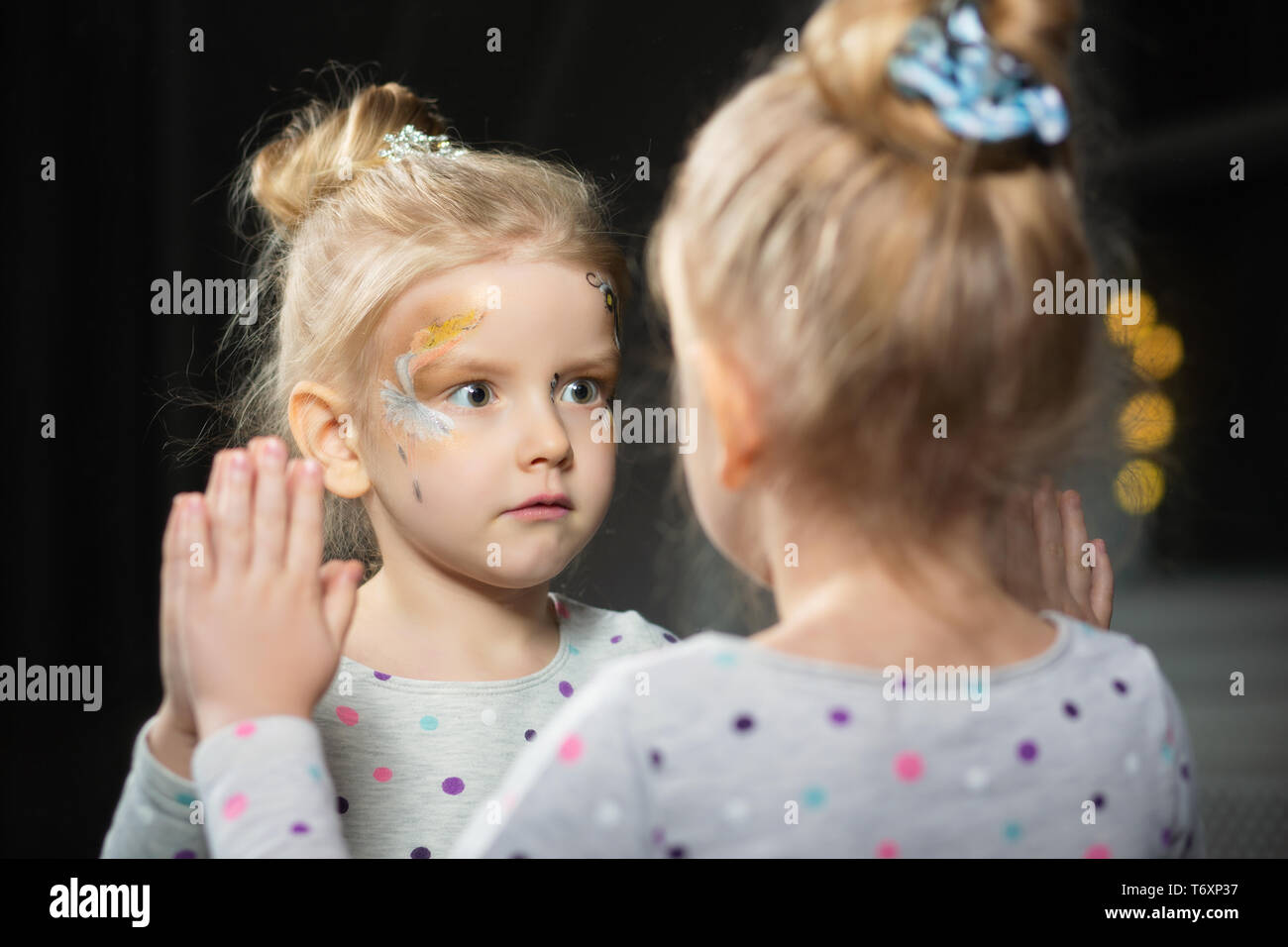 Little girl in the looking glass Stock Photo - Alamy